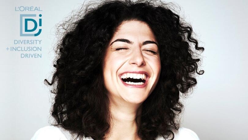 L'Oréal Promotion Showing a close-up of a woman laughing and the tag ...