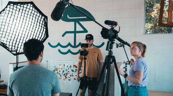 Several people on a film crew
